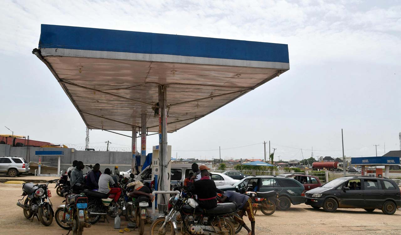 Drivers line up for gasoline across Nigeria after new president scraps fuel subsidy - Telangana ...